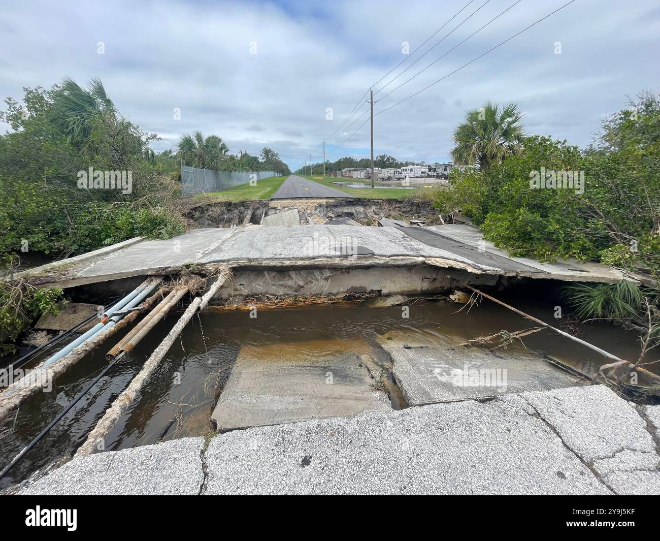 A collapsed roadway is shown on MacDill Air Force Base, Florida ...