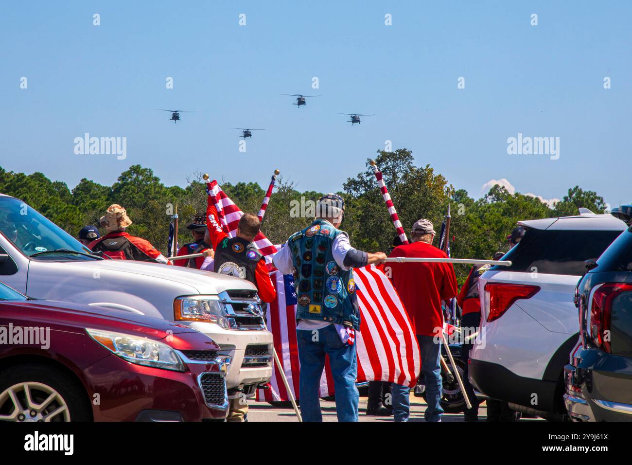 UH-60 Black Hawks organize a flyover during a private interment for ...