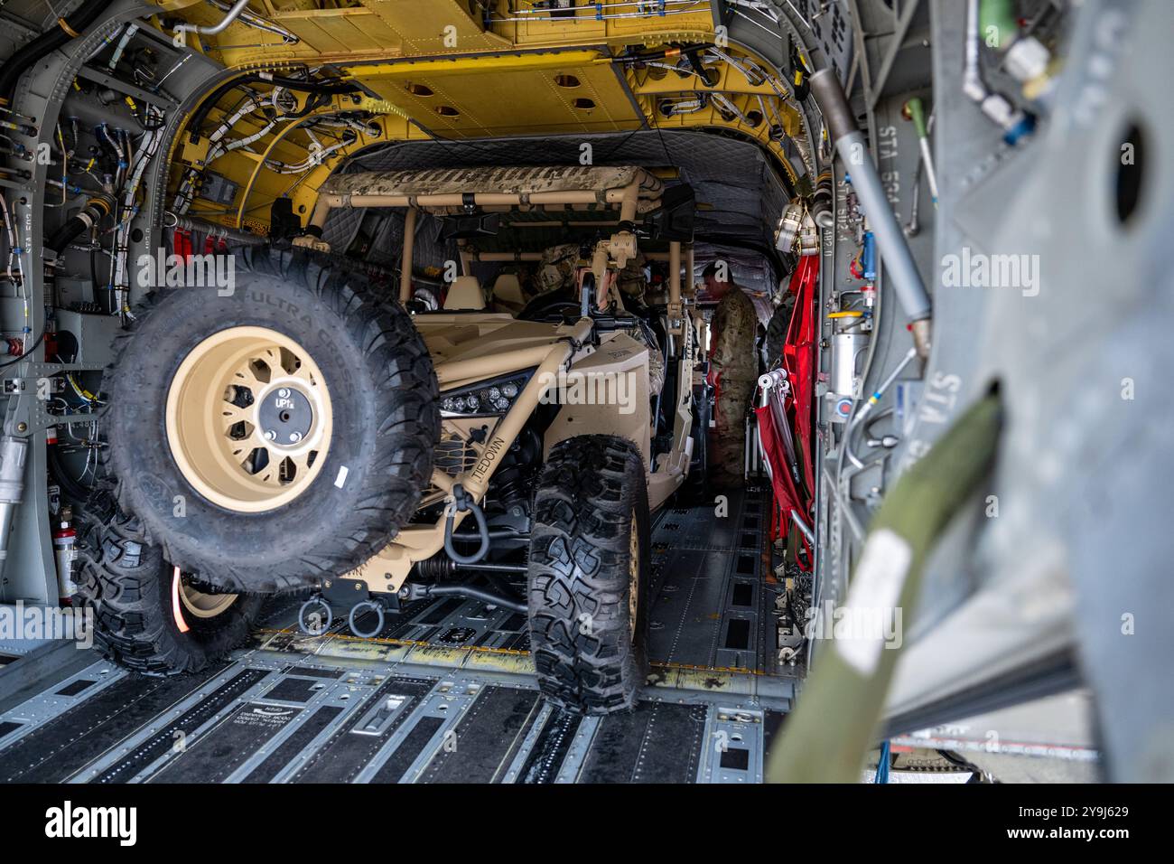 Soldiers assigned to the 3rd Battalion, 20th Special Forces Group load ...