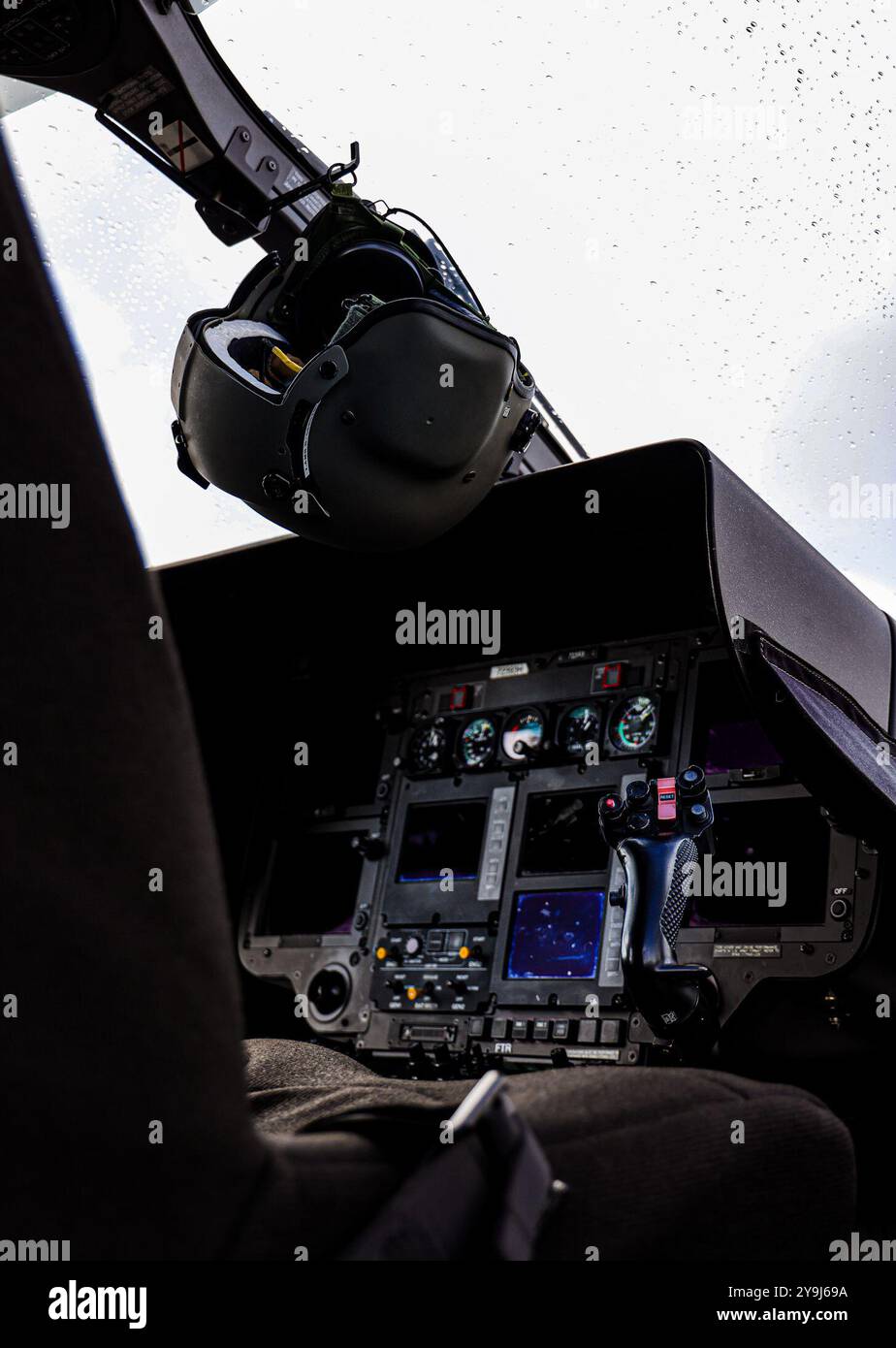 An Initial Entry Rotary Wing (IERW) student helmet hangs in an aircraft ...