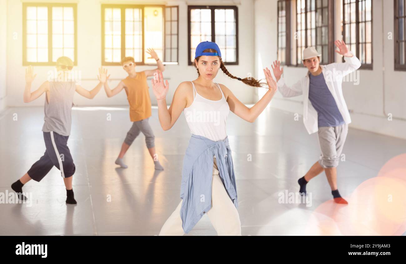 Teenage girl practicing active dance at studio Stock Photo - Alamy
