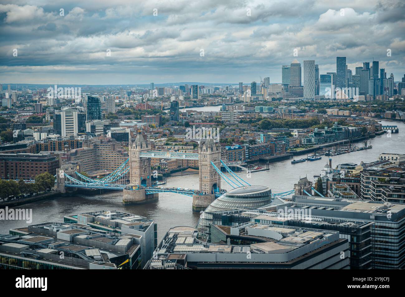 Aerial view of Tower Bridge, London’s skyline, cloudy day along the ...