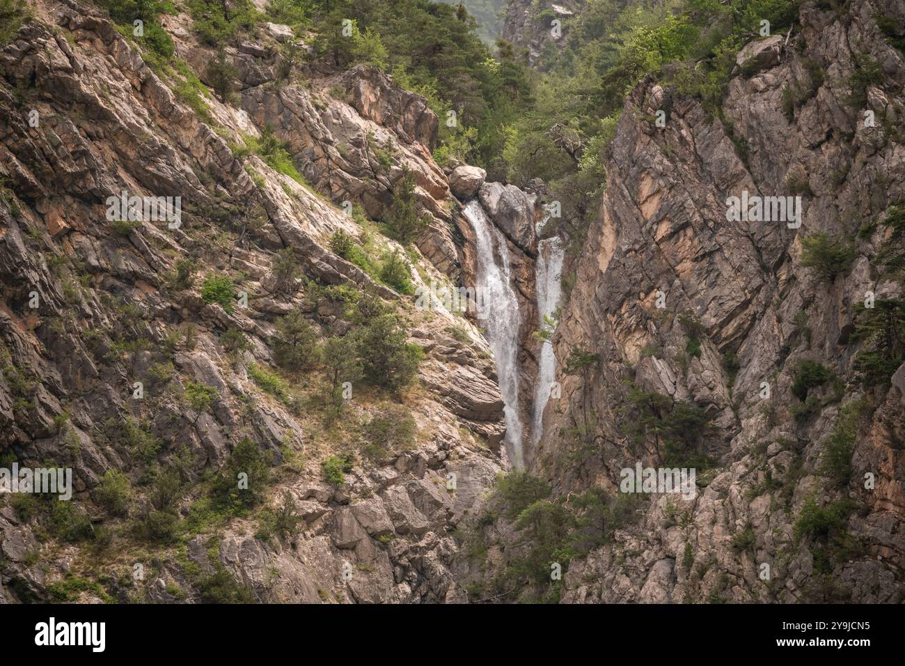 Waterfall Cascading through the Rugged Rocky Cliffs of Saint-Crépin ...