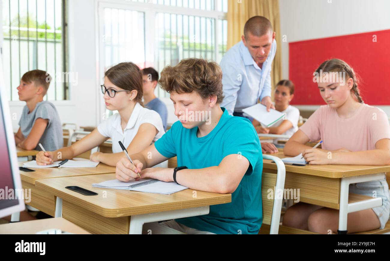 Student is sitting test and answer about task in classroom Stock Photo ...