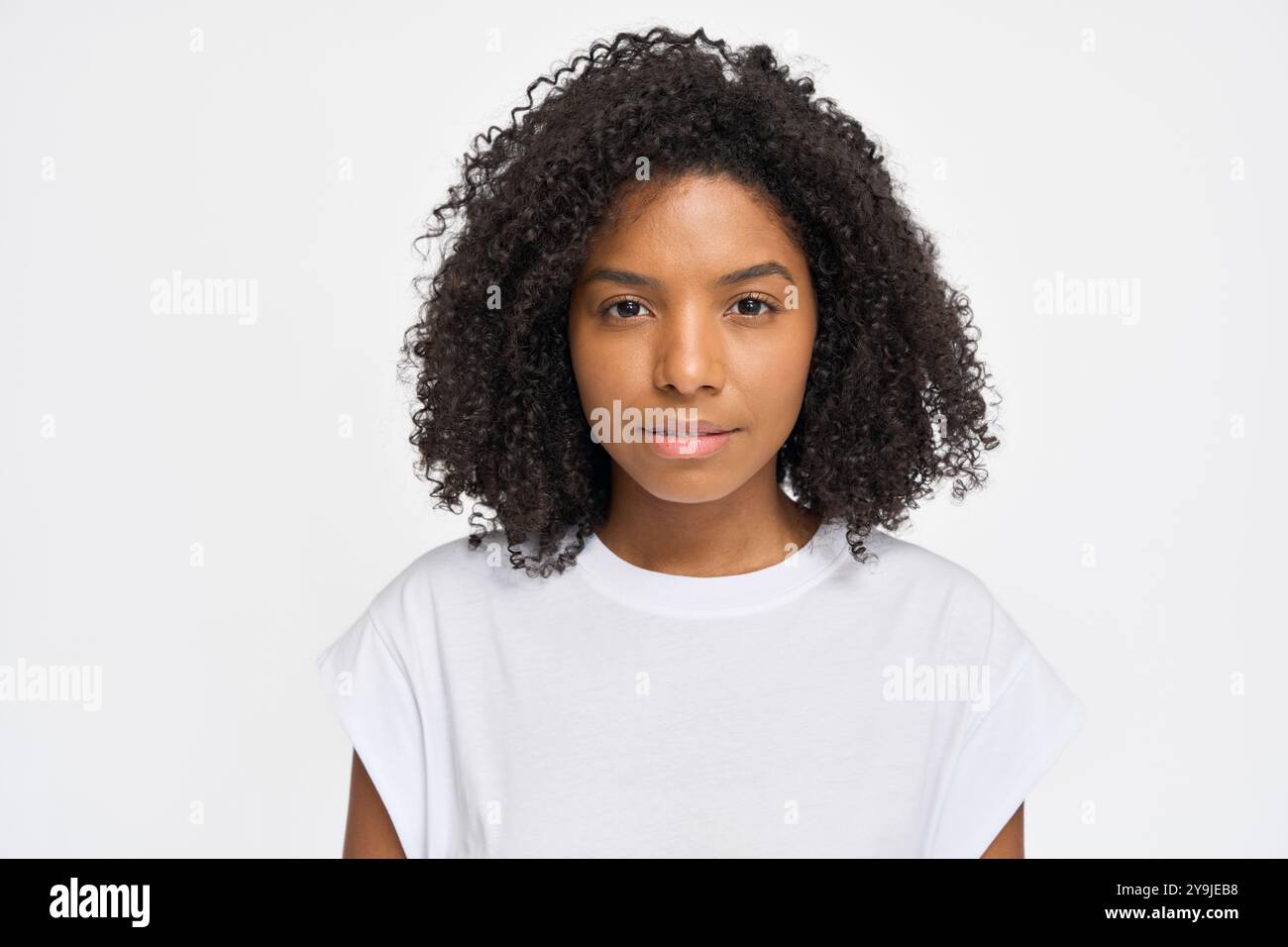 Portrait of young curly generation z African woman isolated on white ...