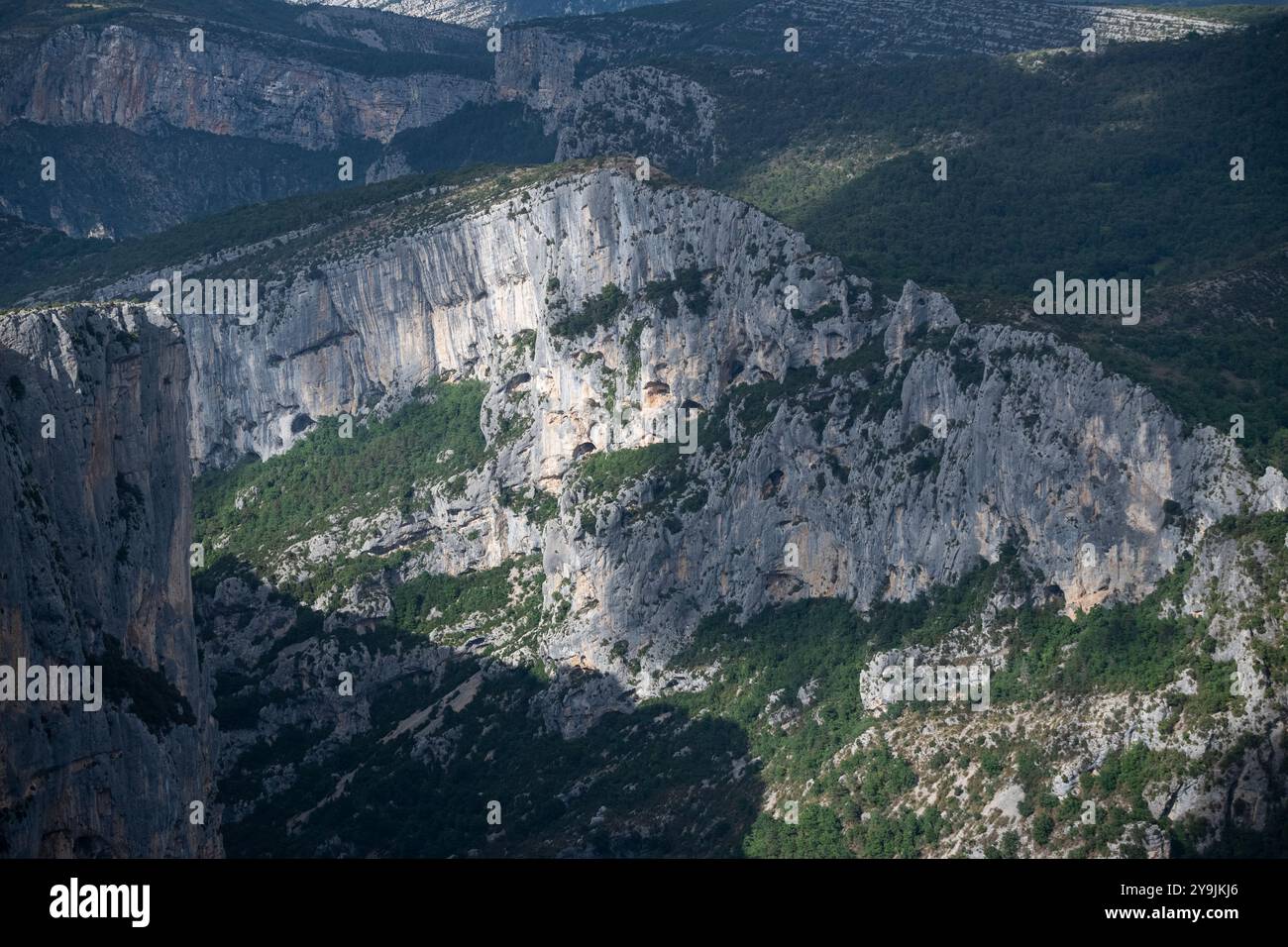 Verdant Cliffs and Caves of Verdon Gorge in France, with sunlight ...