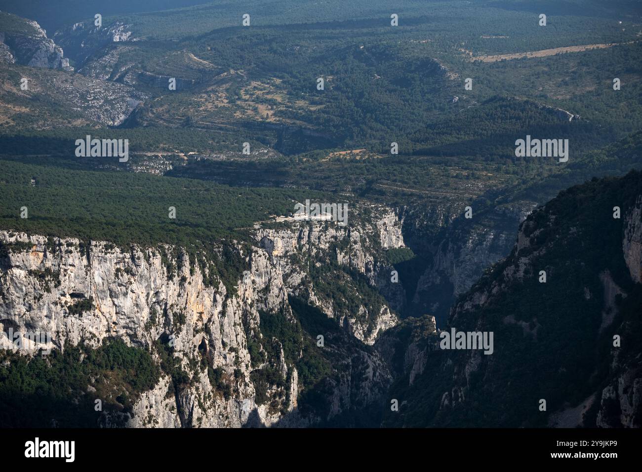 Verdant Cliffs and Caves of Verdon Gorge in France, with sunlight ...