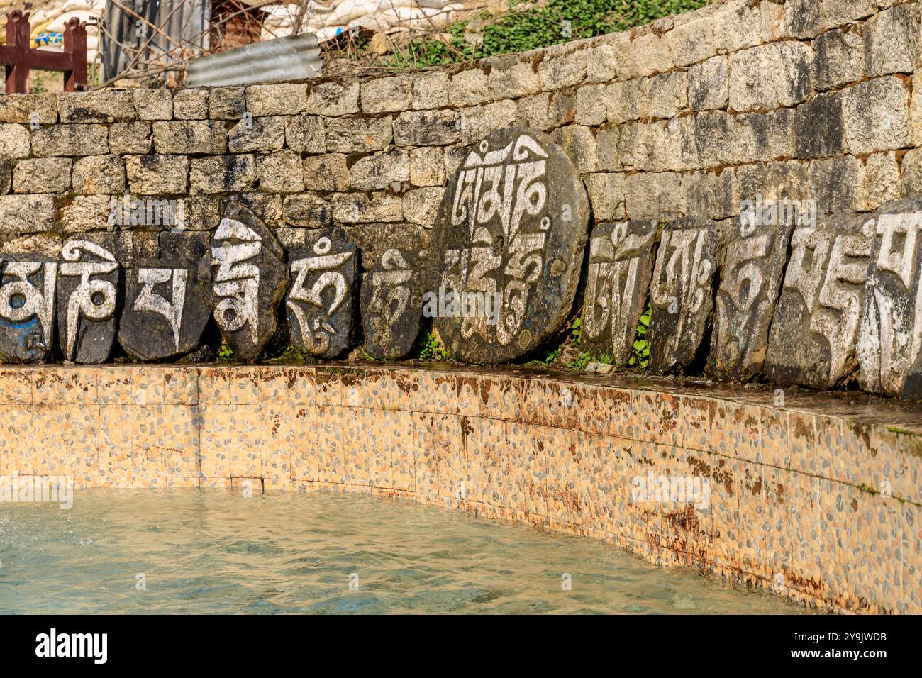 Mani stones with sacred symbols in Nepal Himalaya mountains standing ...