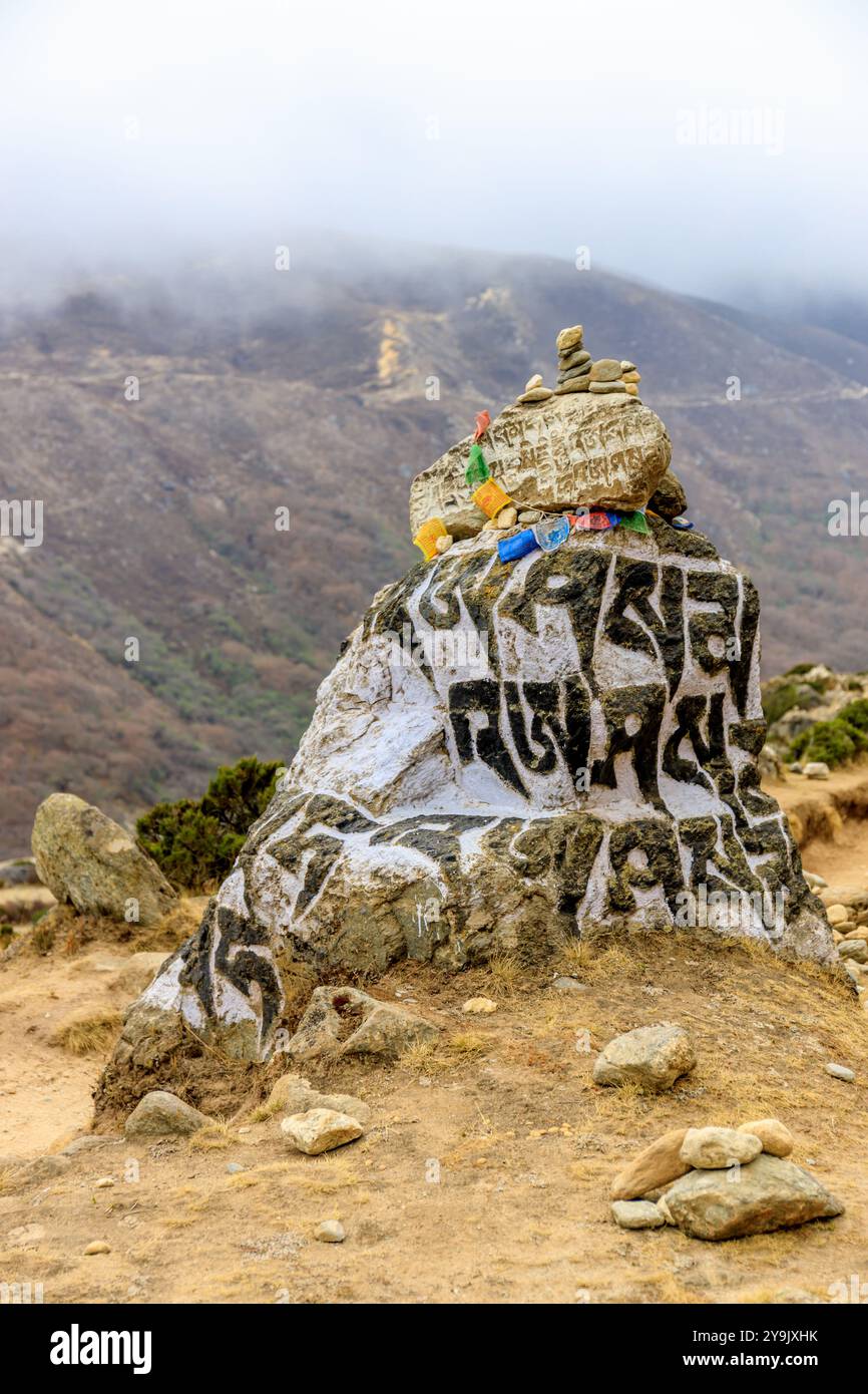 Mani stones with sacred symbols in Nepal Himalaya mountains standing ...