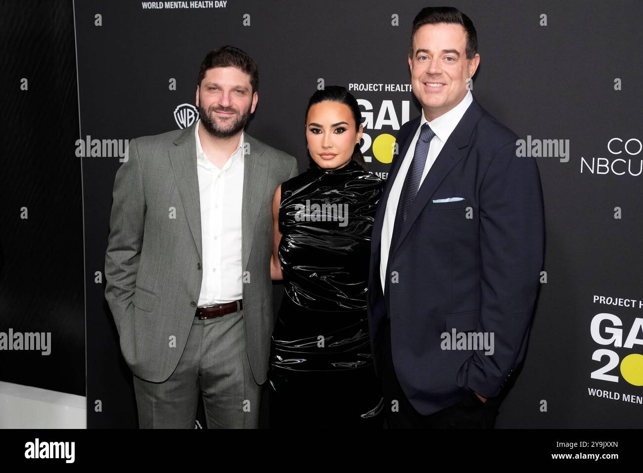 Michael D. Ratner, from left, Demi Lovato and Carson Daly attend the ...