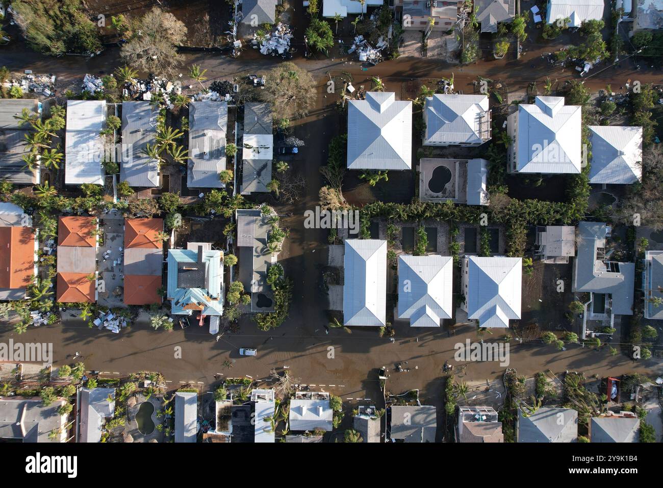 Flood waters recede after Hurricane Milton, on streets where piles of ...