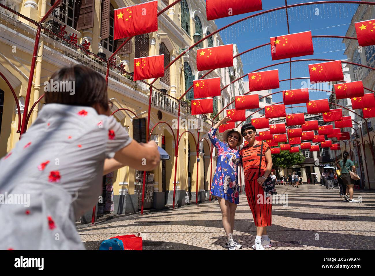 Mainland Chinese tourists pose for photos at the Senado Square with ...
