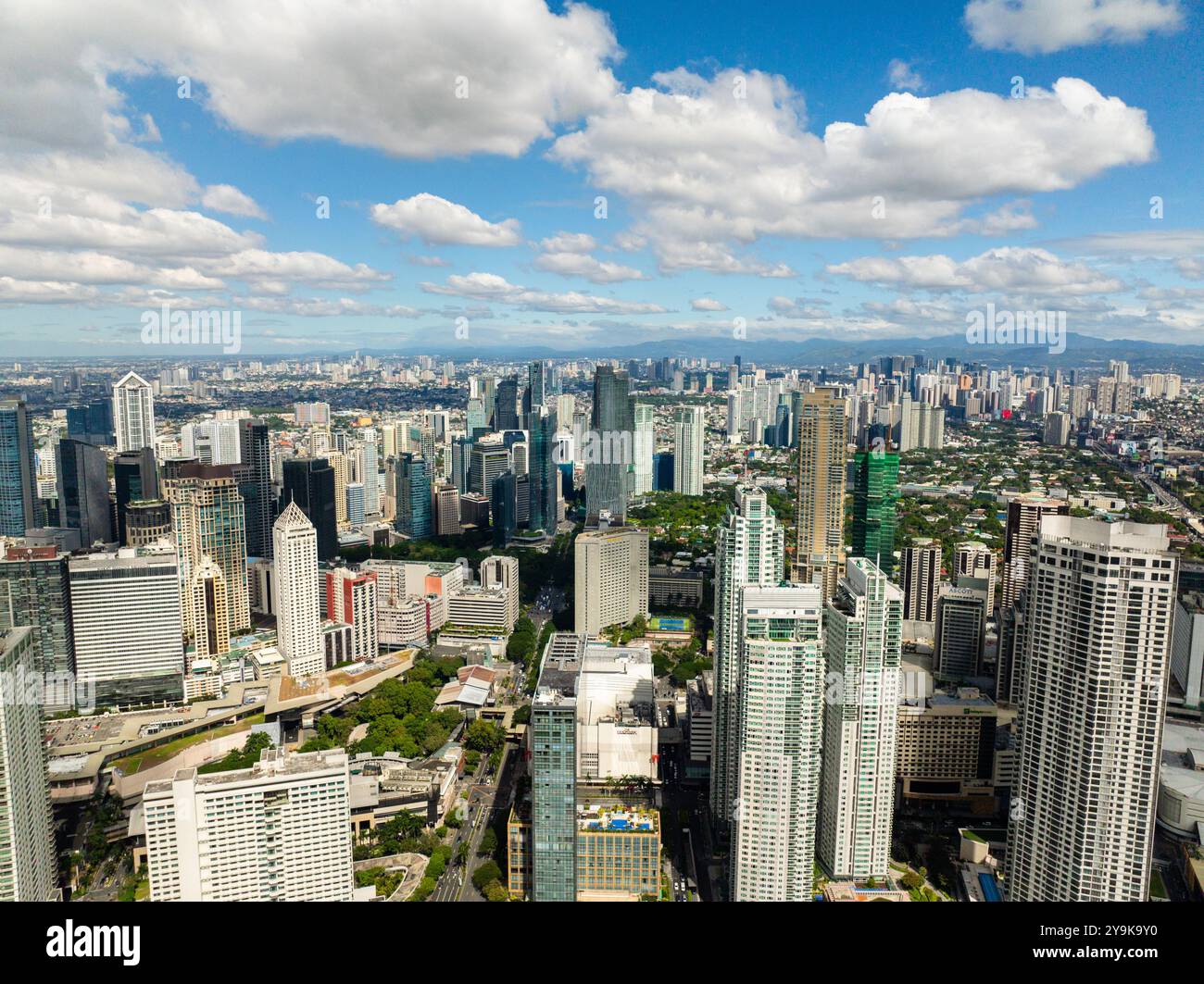 High rise buildings in Makati. Blue sky and clouds. Metro Manila ...