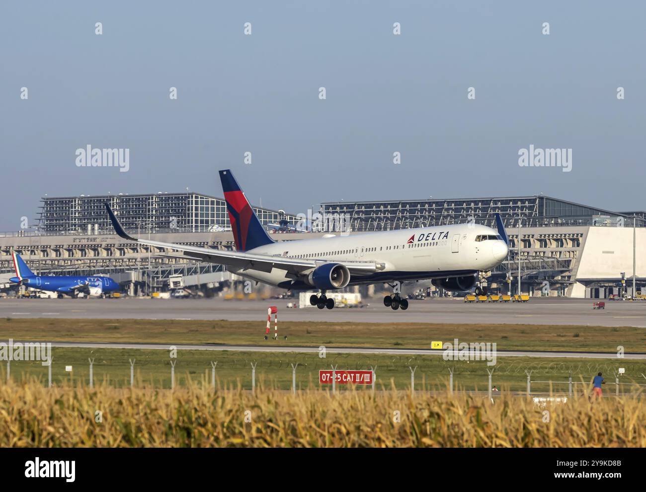 Stuttgart Airport with terminal, Delta Air Lines aircraft landing ...