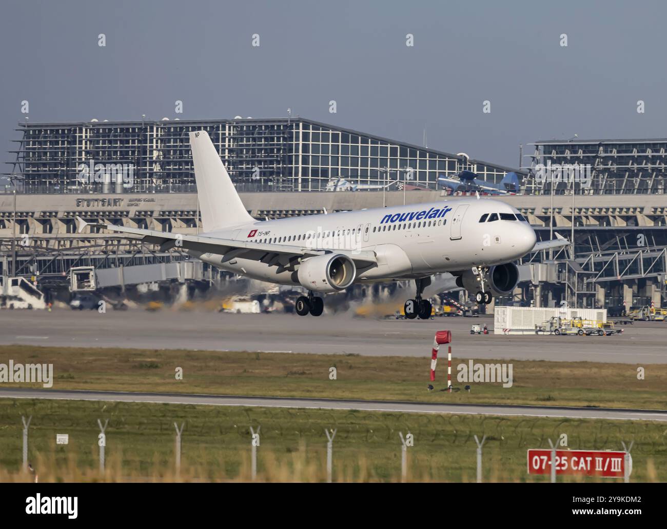 Stuttgart Airport with terminal, Nouvelair aircraft landing. Stuttgart ...