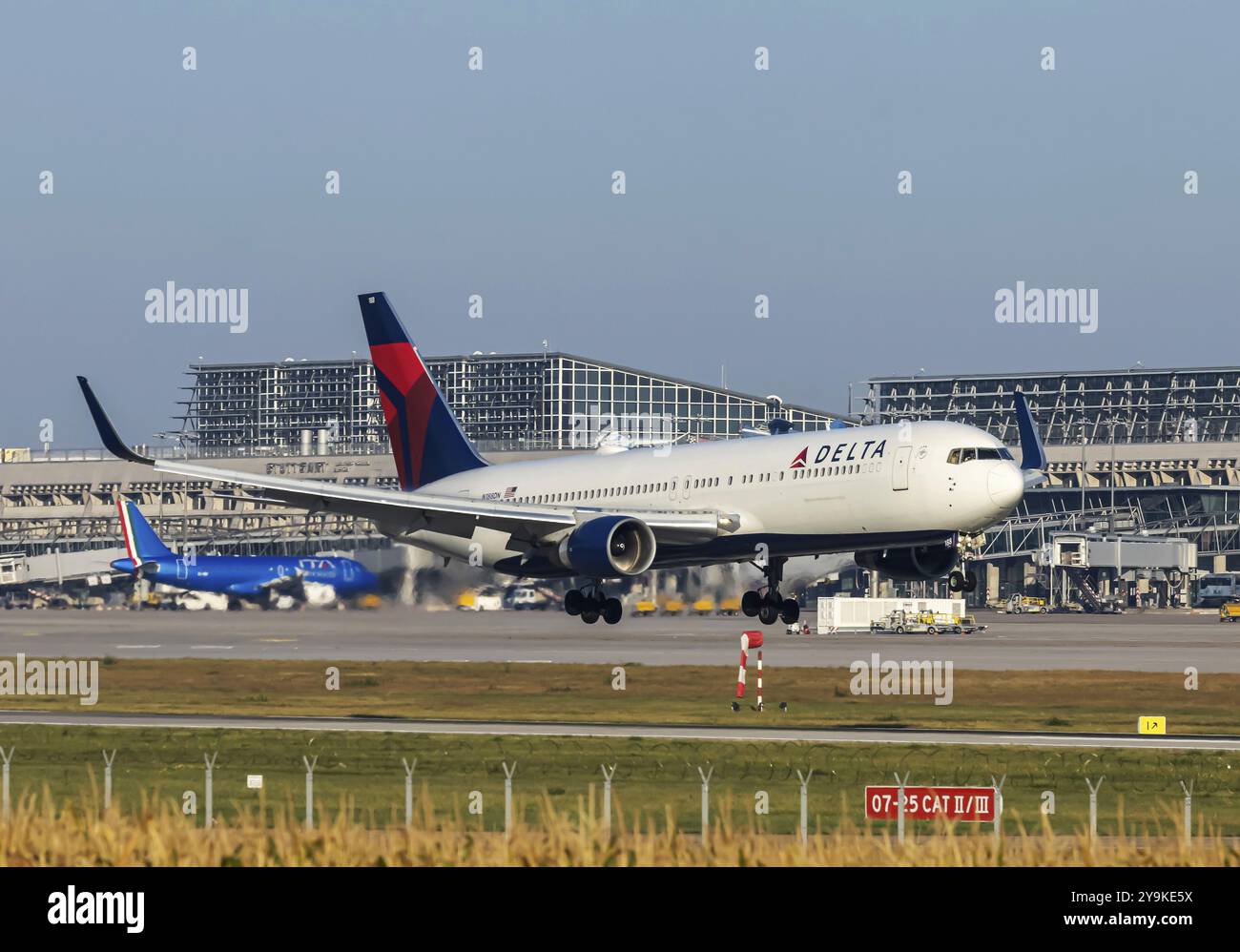 Stuttgart Airport with terminal, Delta Air Lines aircraft landing ...