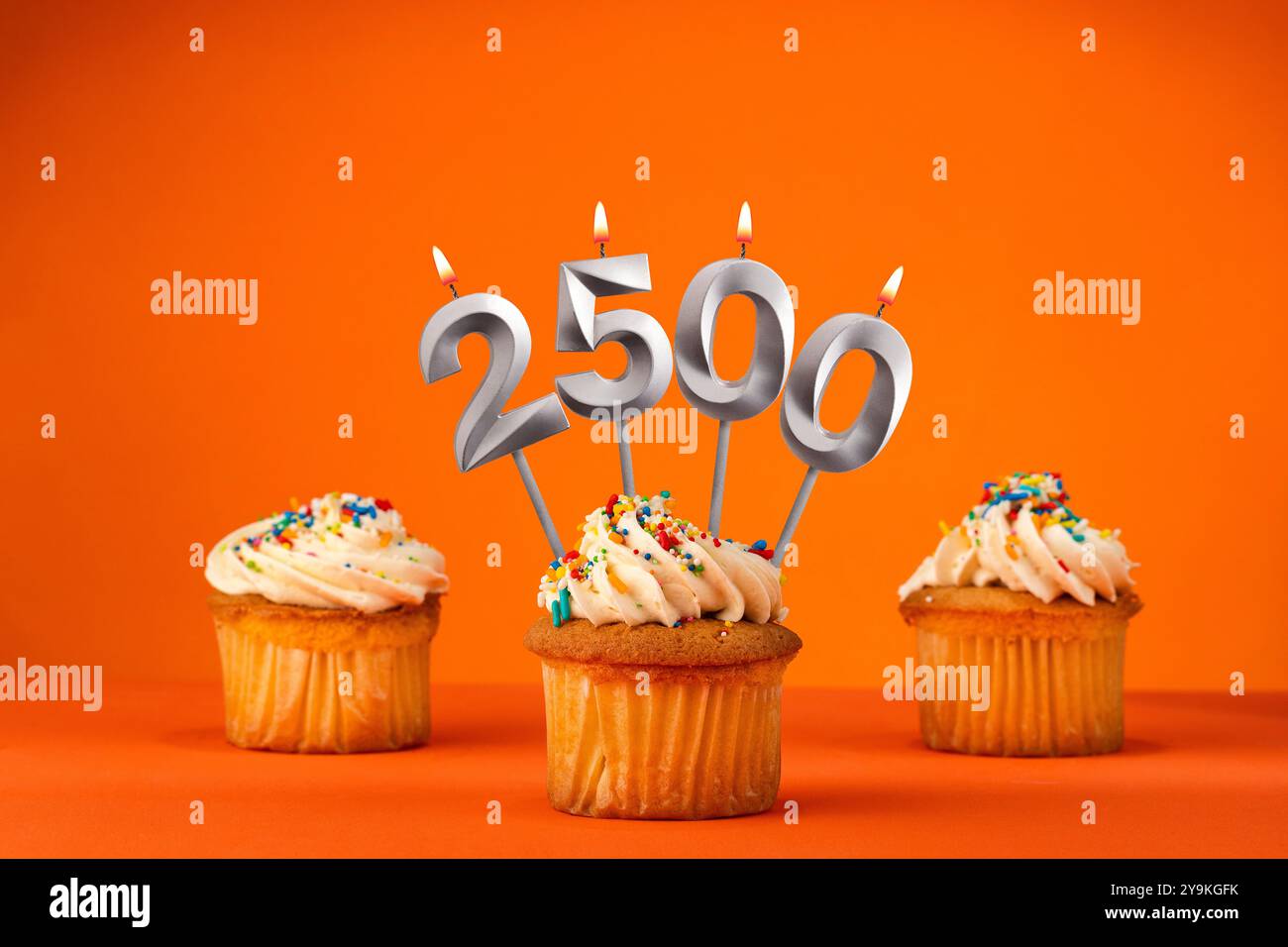 Birthday celebration in orange color - Candle number 2500 Stock Photo ...