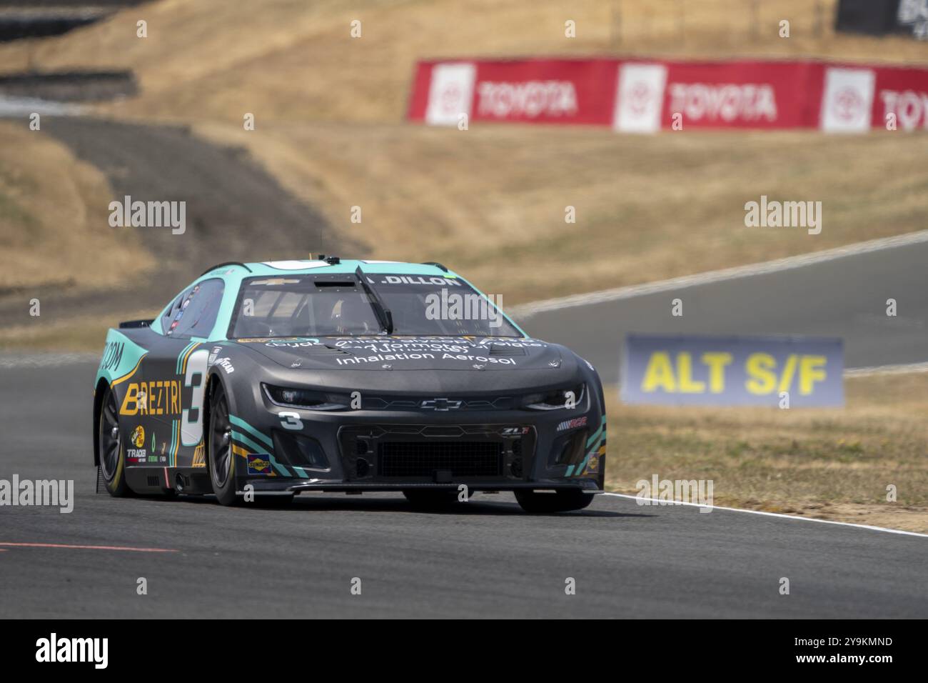 NASCAR Driver, Austin Dillon, races for position through the turns for ...