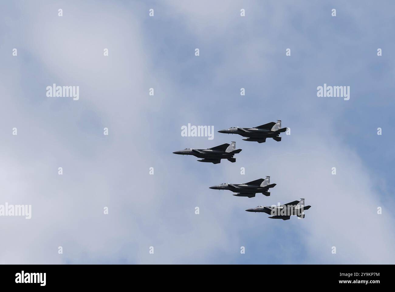 A group of military airplanes perform a thrilling flyover above the ...