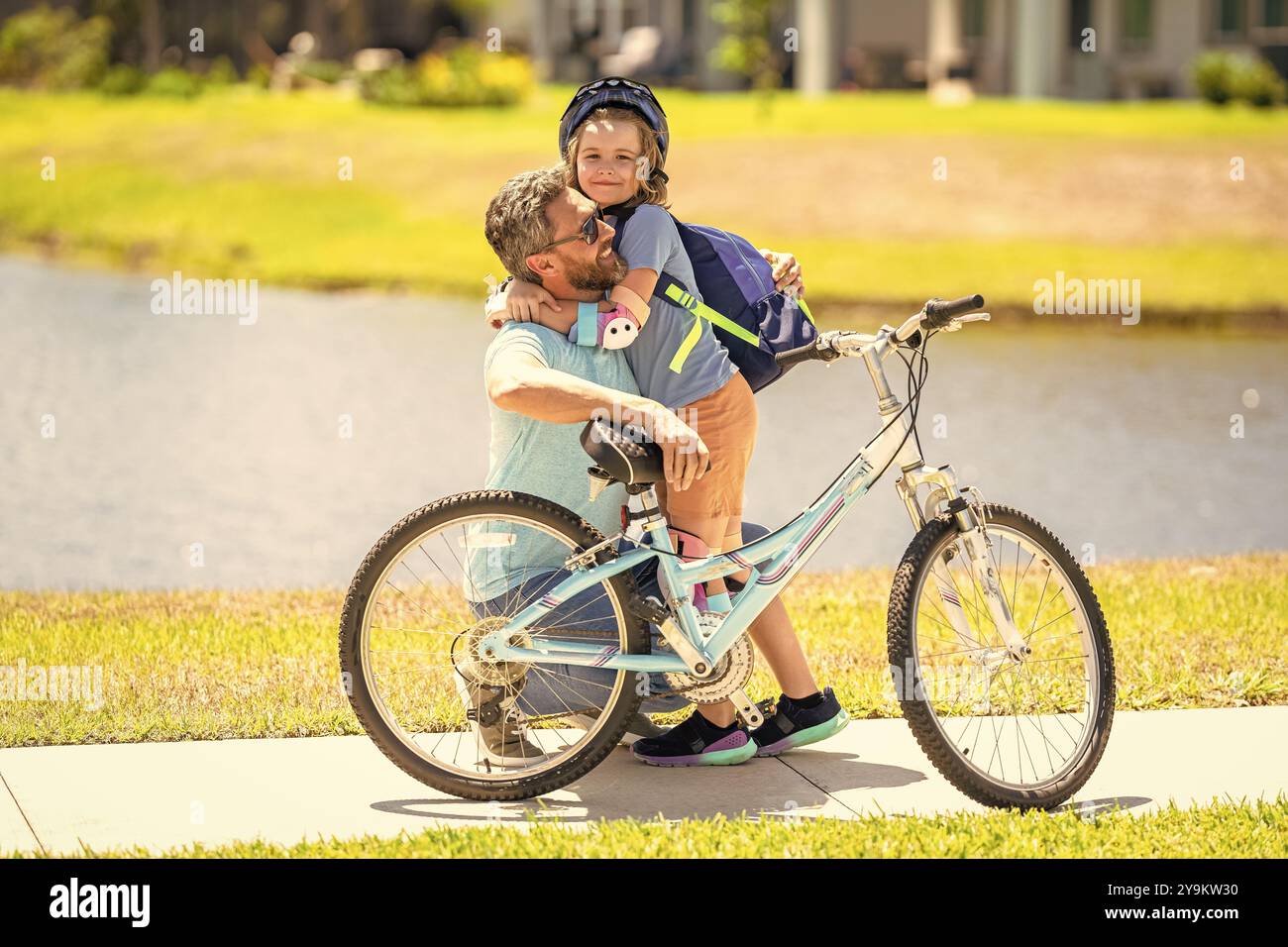 Happy Son And Daddy Cycling On Bicycle Daddy Teaching His Son Child To