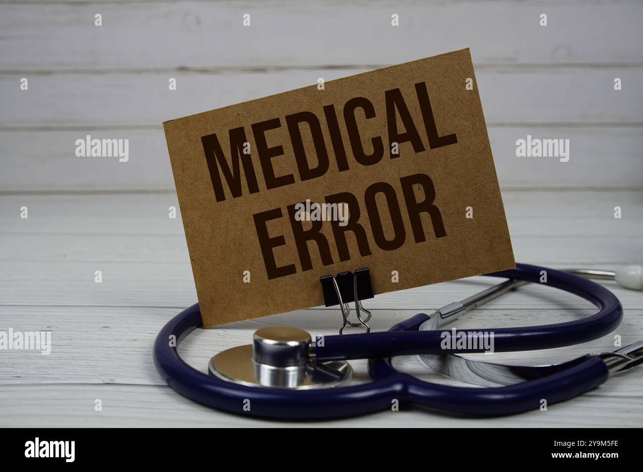 Medical Error text message on paper card with stethoscope on wooden ...