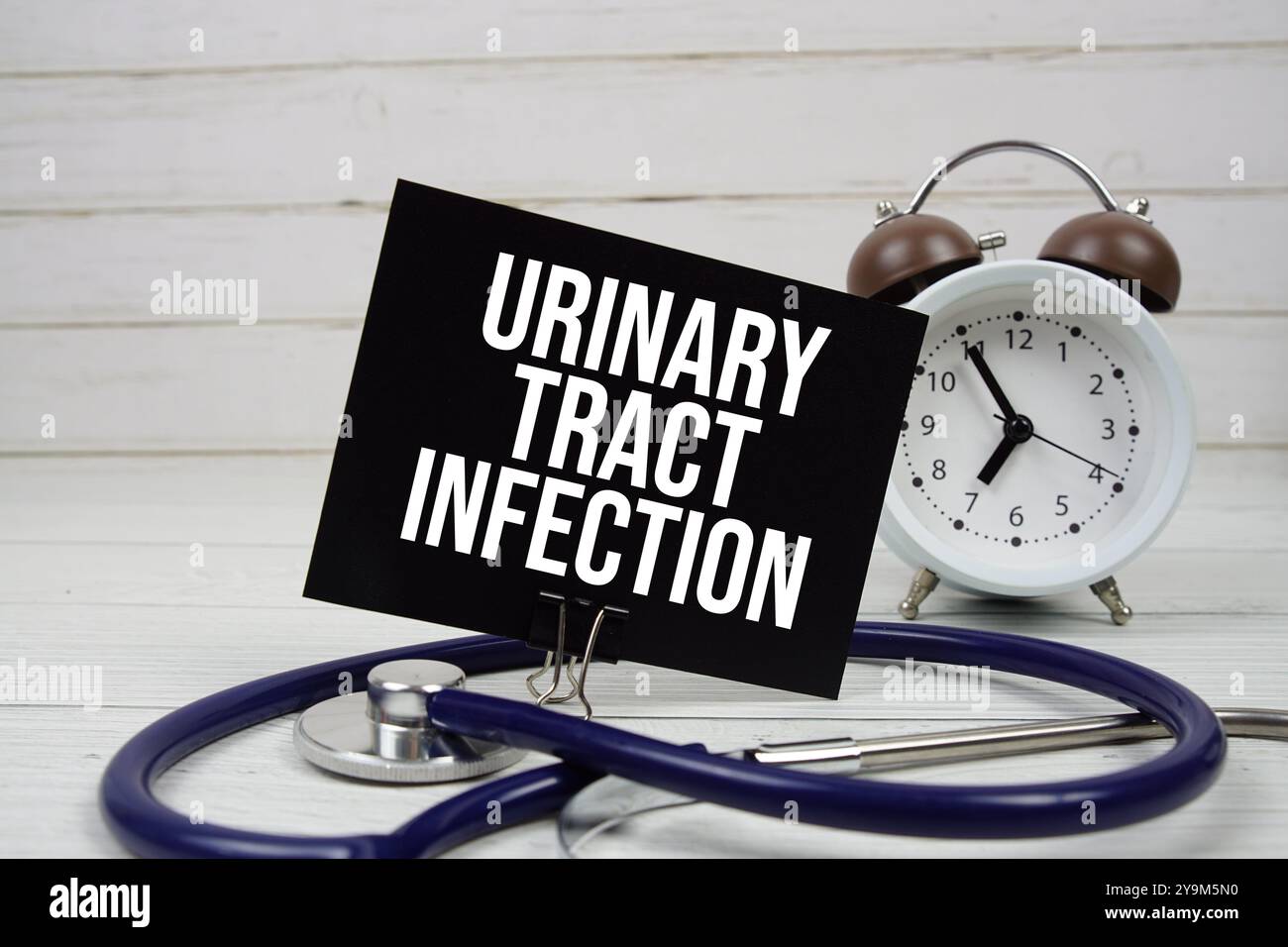 Urinary Tract Infection text message on paper card with stethoscope on ...