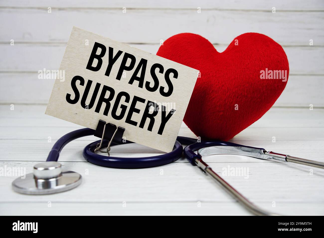 Bypass Surgery text message on paper card with stethoscope on wooden ...