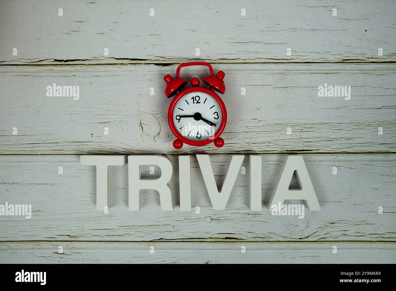Trivia alphabet letters with alarm clock top view on wooden Stock Photo ...
