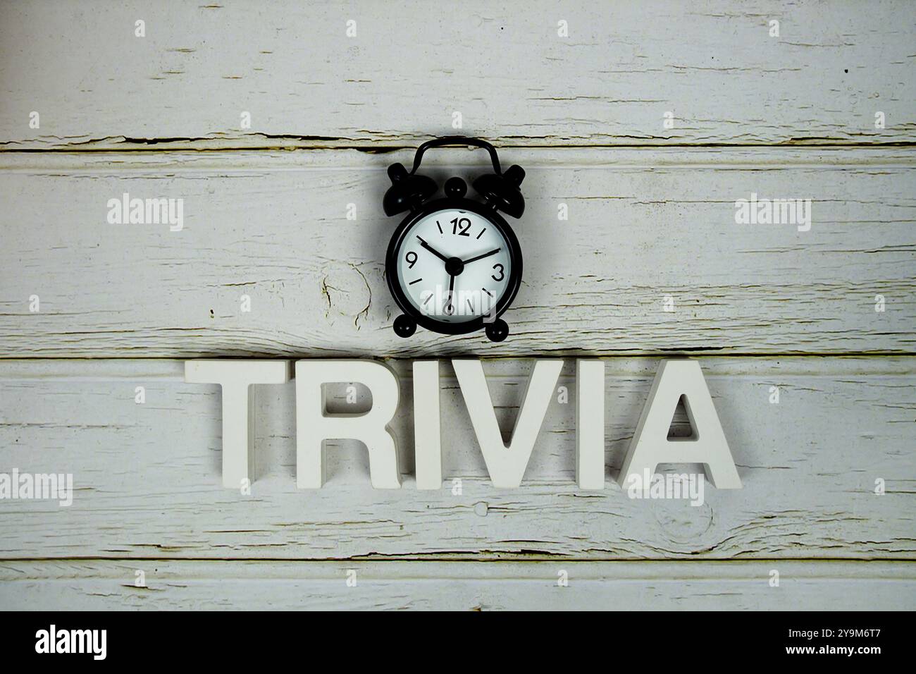 Trivia alphabet letters with alarm clock top view on wooden Stock Photo ...