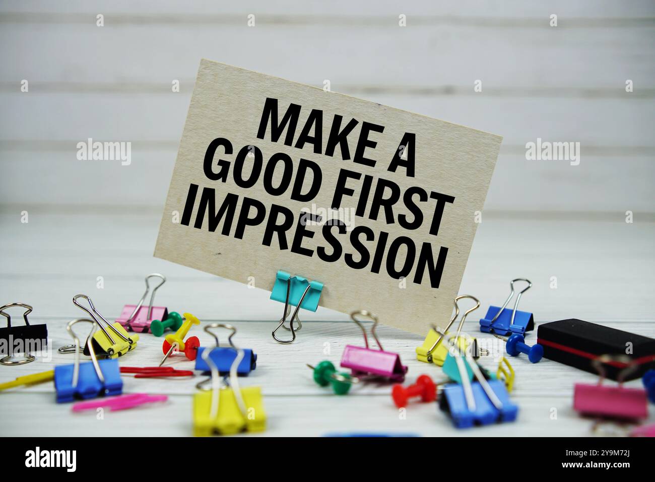 Make A Good First Impression text on paper card with stationary on ...