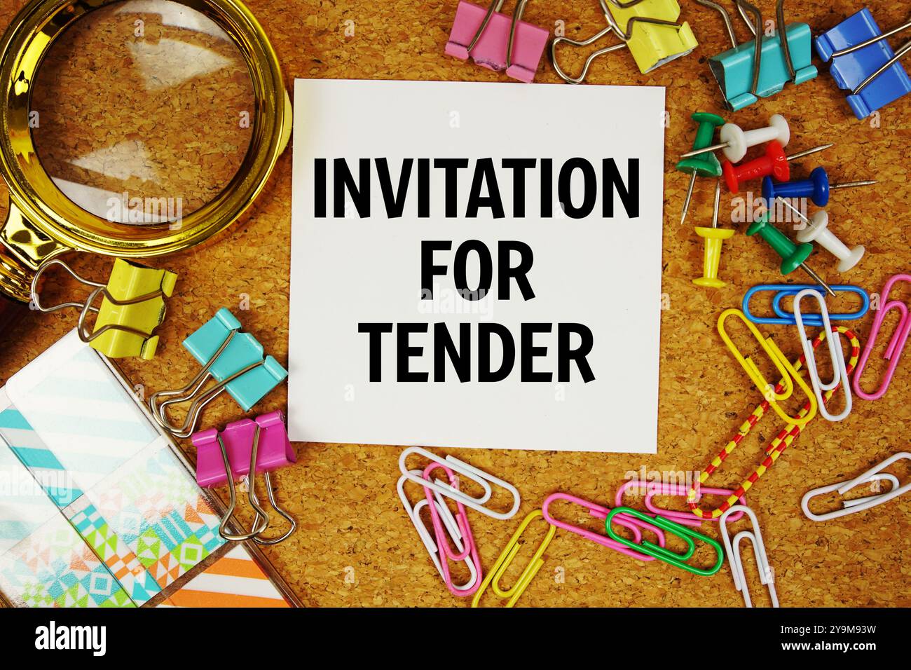 Invitation For Tender text on paper card with magnifying glass and ...