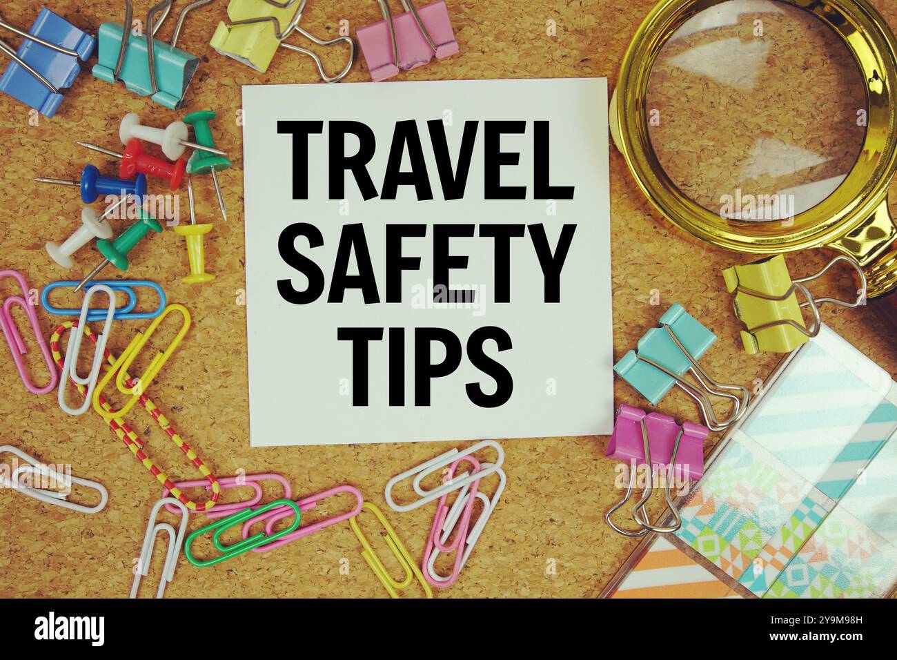 Travel Safety Tips text on paper card with magnifying glass and ...
