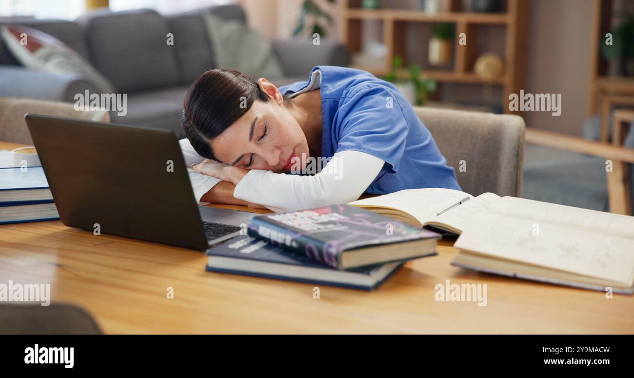 Nurse, sleeping and tired on table with laptop, burnout and exhausted ...