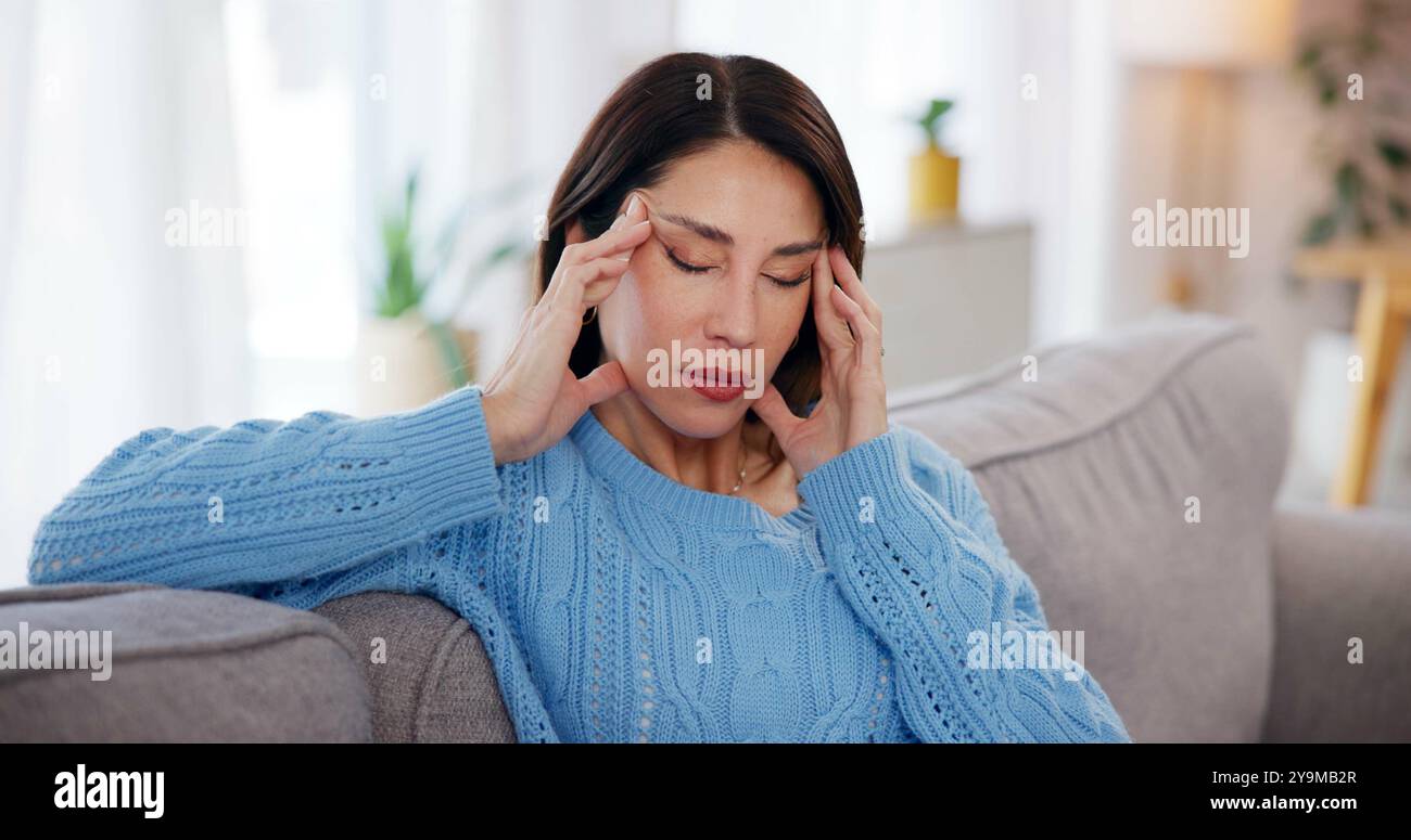 Woman, headache and stress on sofa in home with brain fog, dizzy and ...