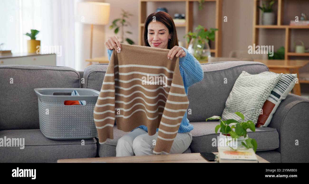 Laundry, cleaning and woman on sofa with smile, washing basket and home ...