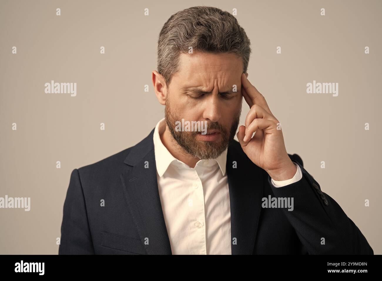 Headache and strain. Headache, tiredness and stress. Businessman in ...