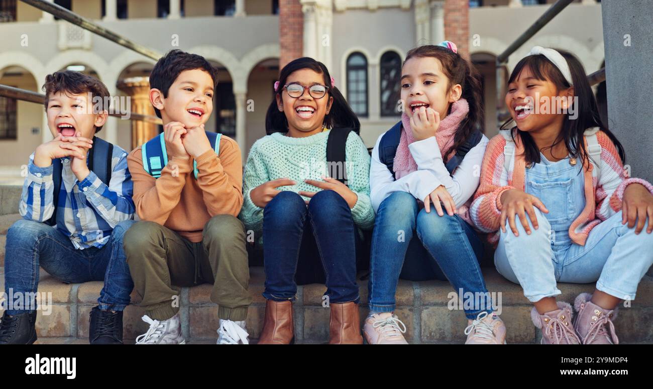 School kids, happy and friends on stairs for laughing, joke and excited ...