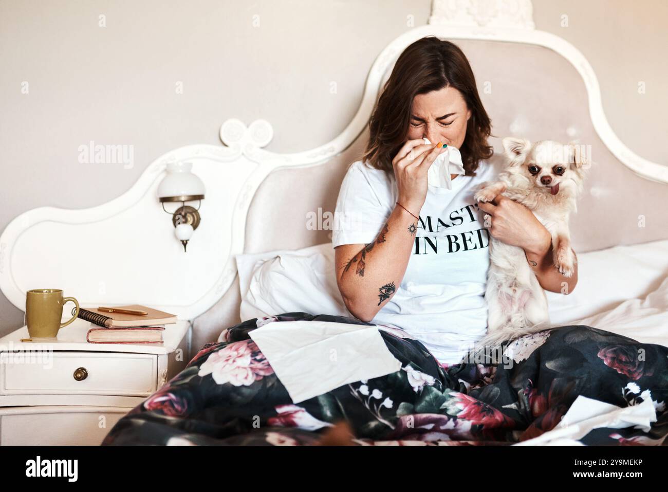 Tissue, sick and woman with dog, bedroom, sneezing and blowing of nose ...