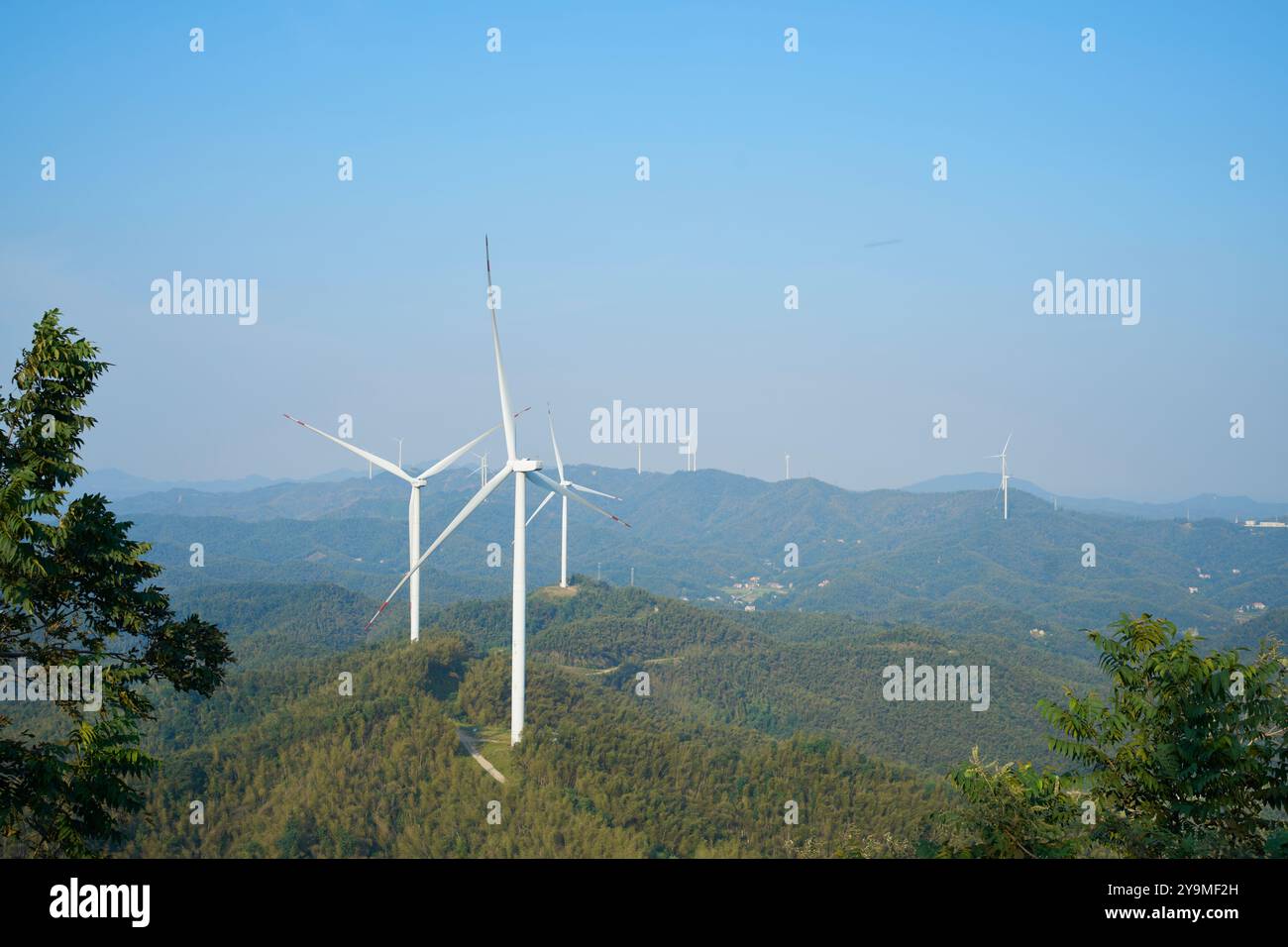 Wind power generation distributed on mountaintops Stock Photo - Alamy