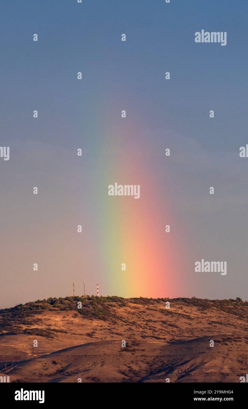 Rainbow Over the Hill: A Gentle Touch After the Rain Stock Photo - Alamy