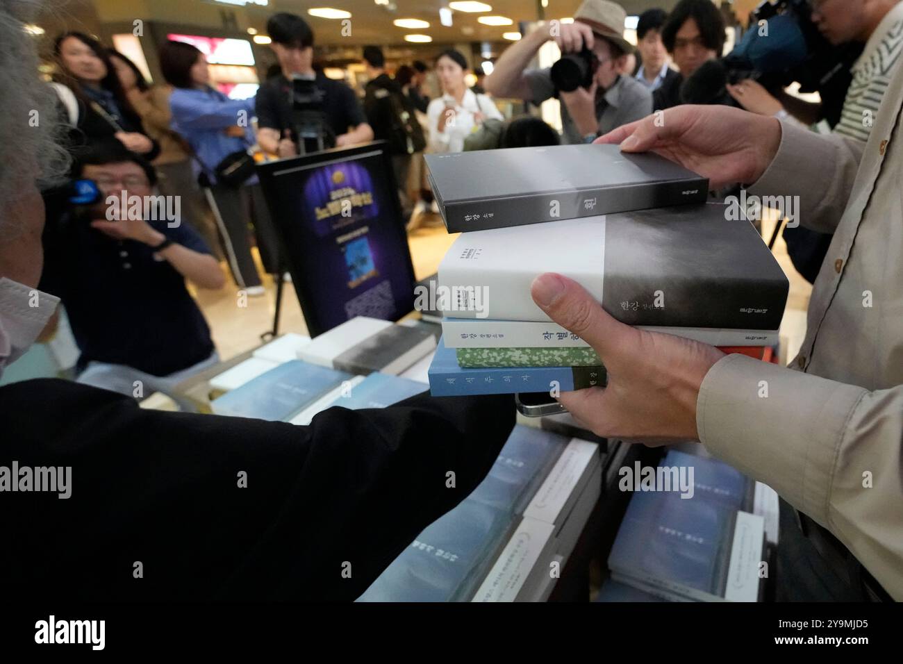 Visitors buy books by South Korean poet and novelist Han Kang at a ...