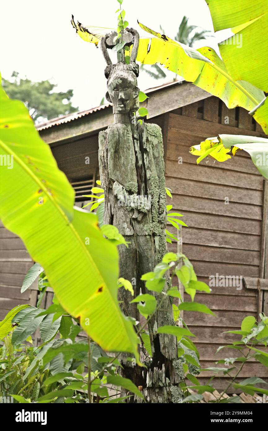 A human-shaped wooden totem pole in Nanga Raun village, Kalis, Kapuas ...