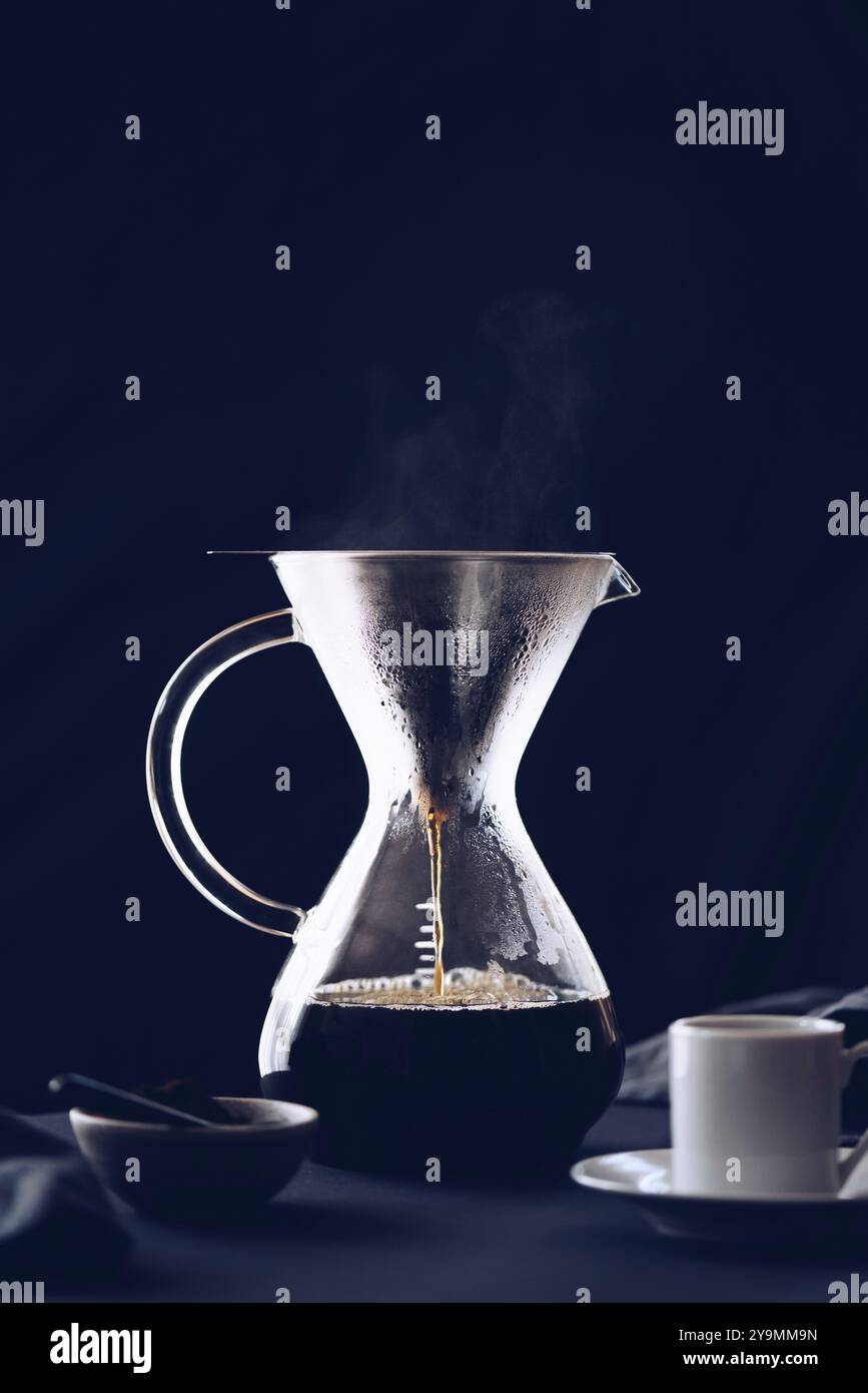 Brewing coffee with a filter dripper. Coffee dripping through a paper ...