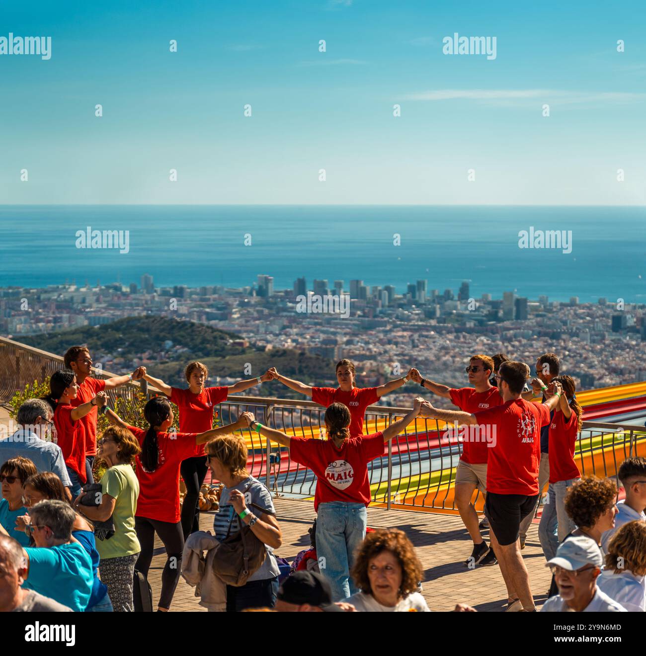Group of people dancing the Catalan folk dance, the sardana with a view ...