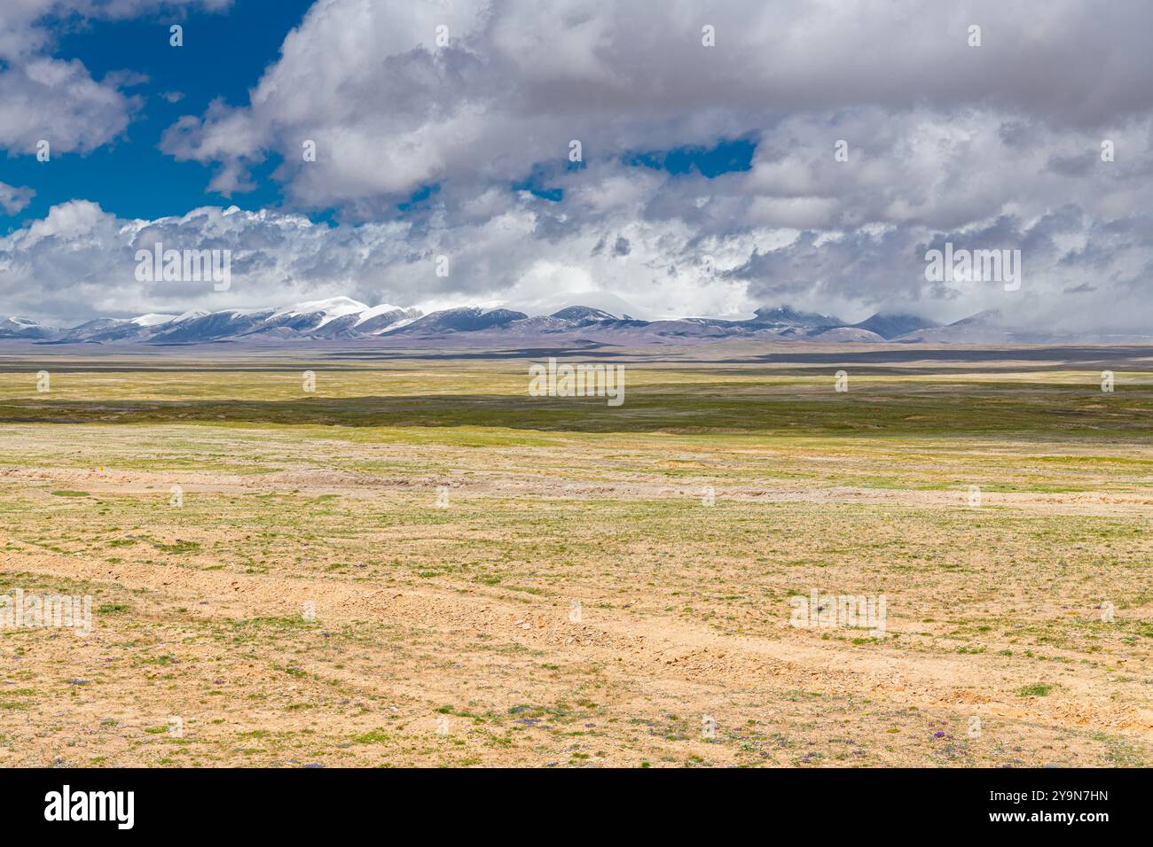 Panoramic view of snow capped mountain ranges and cloudscape of Kunlun ...
