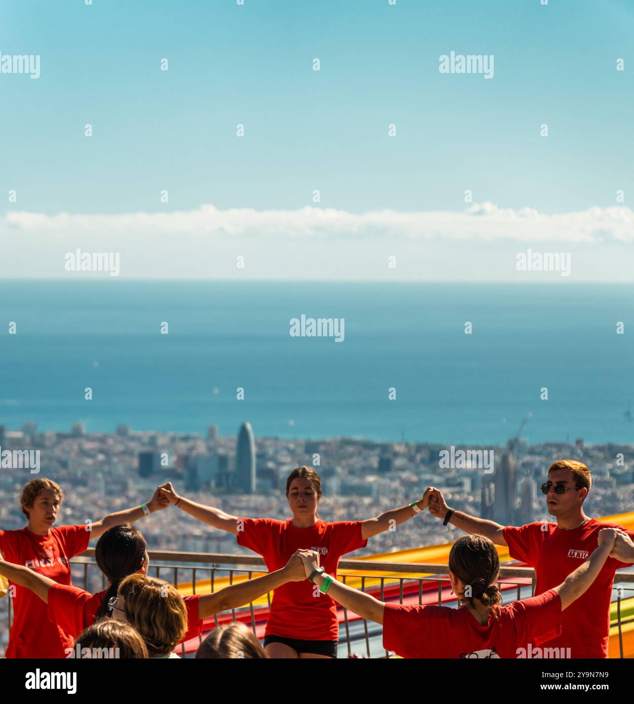 Group of people dancing the Catalan folk dance, the sardana with a view ...