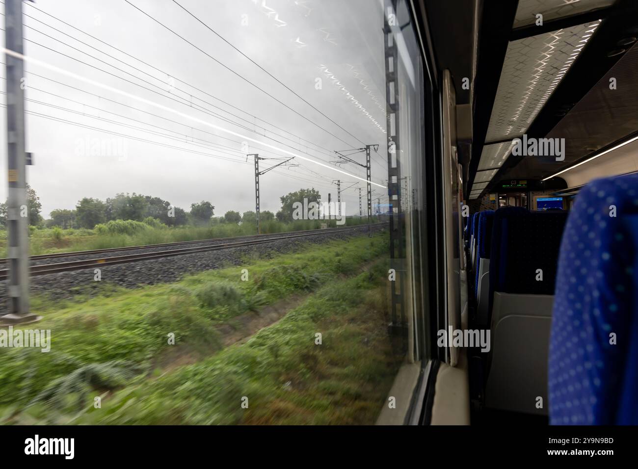 Passenger Train Window View During Daytime with motion blur image is ...