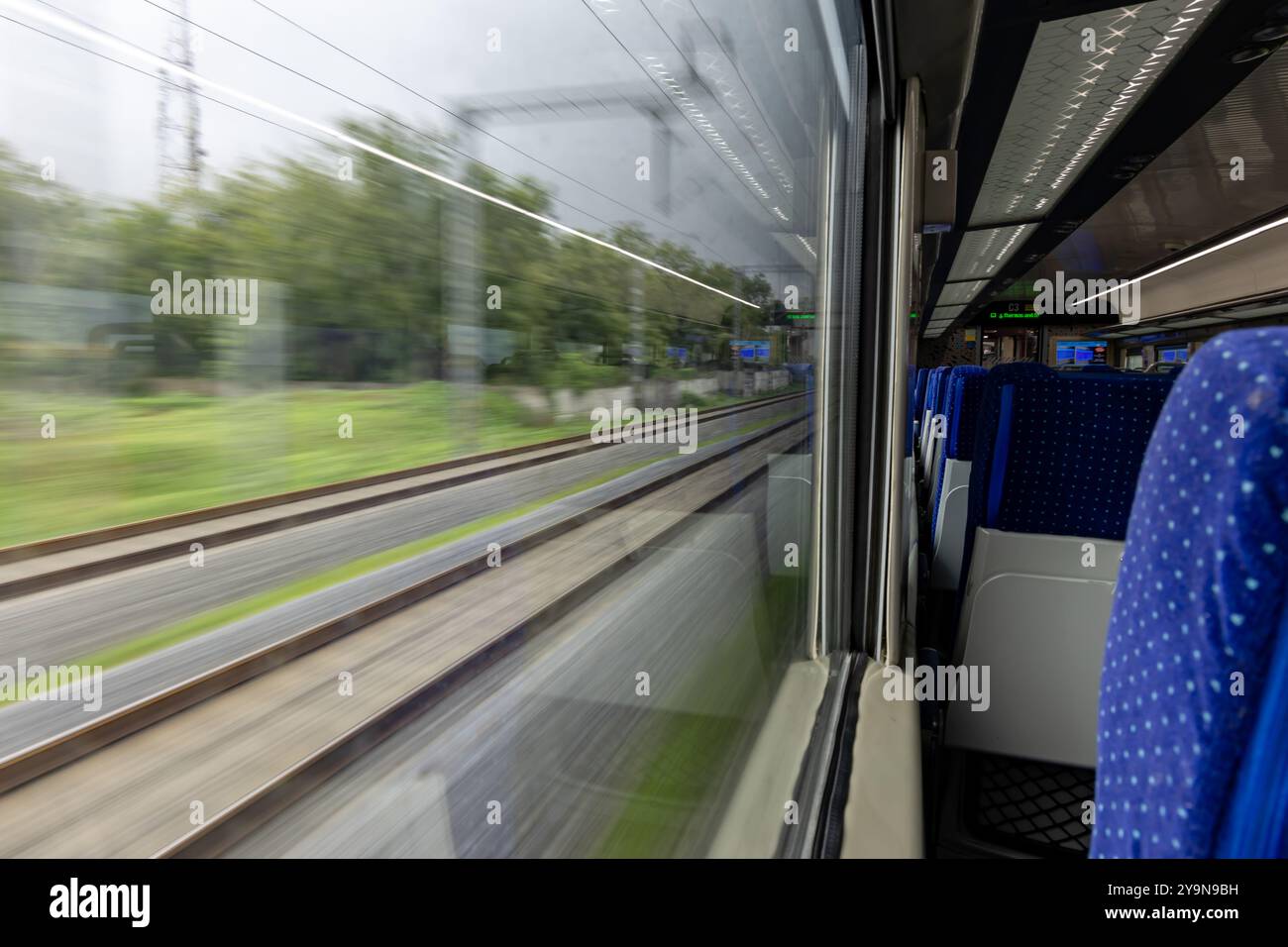 Passenger Train Window View During Daytime with motion blur Stock Photo ...