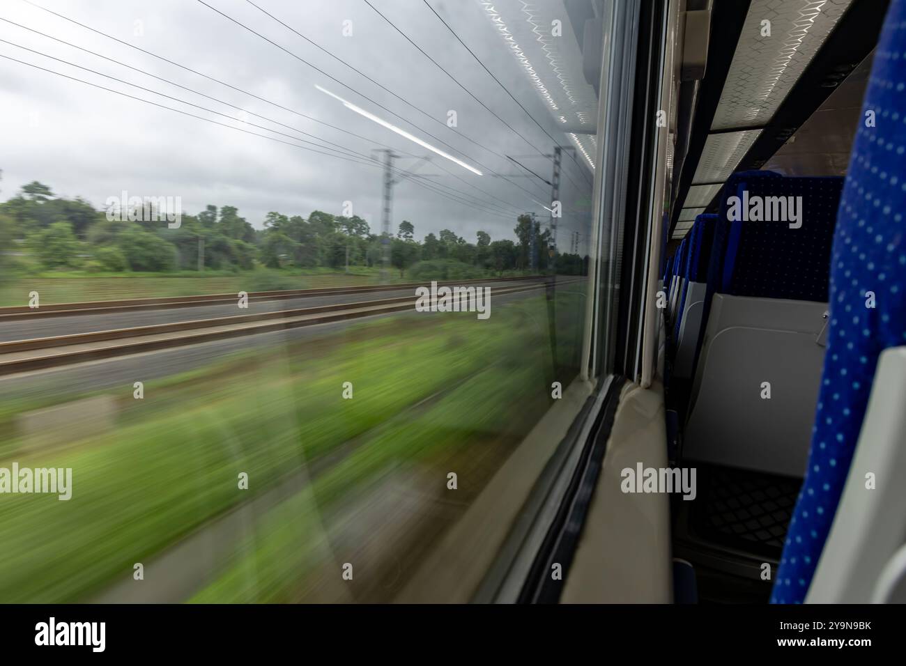 Passenger Train Window View During Daytime with motion blur Stock Photo ...