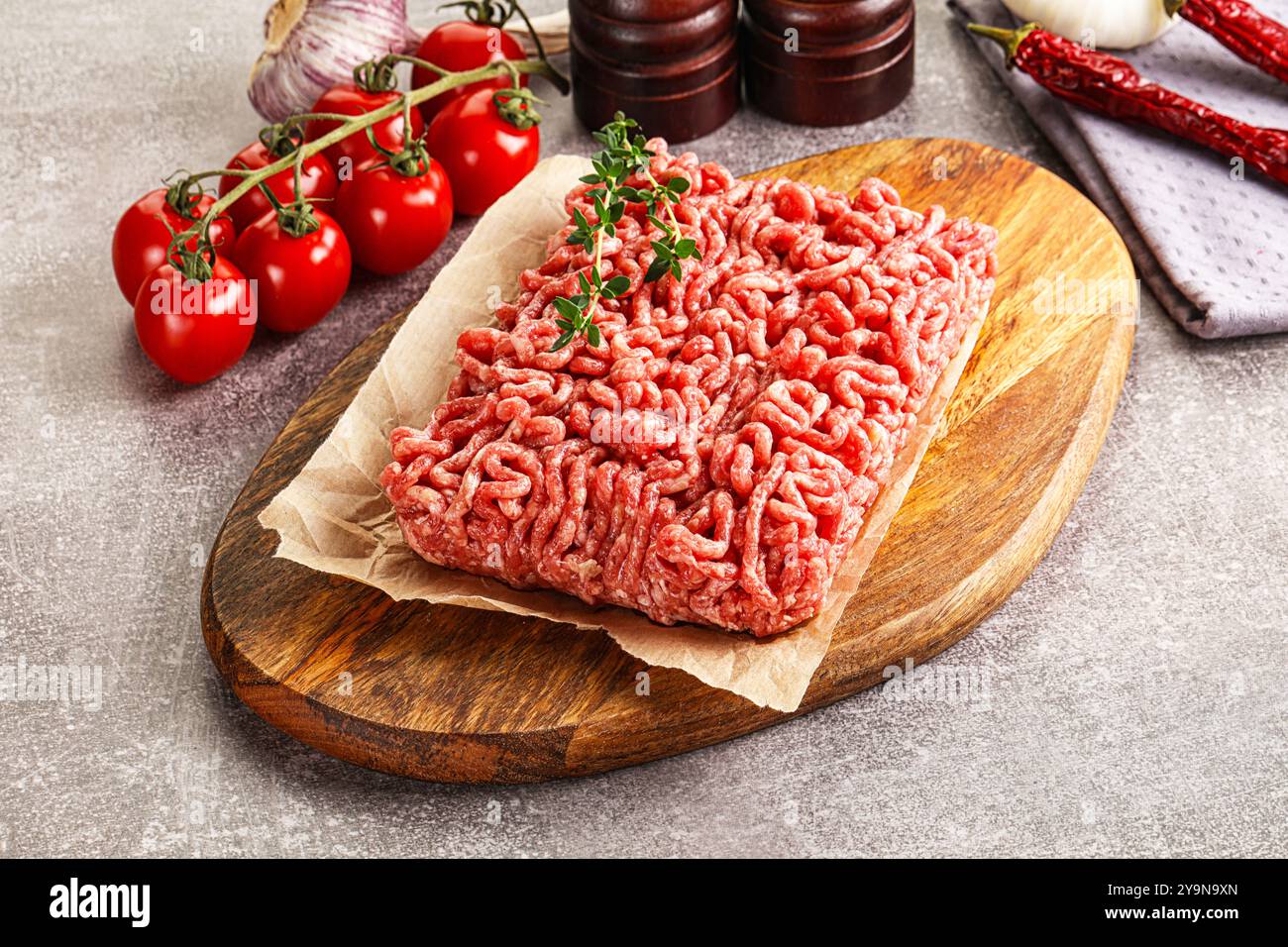 Raw minced beef uncooked meat over board Stock Photo - Alamy